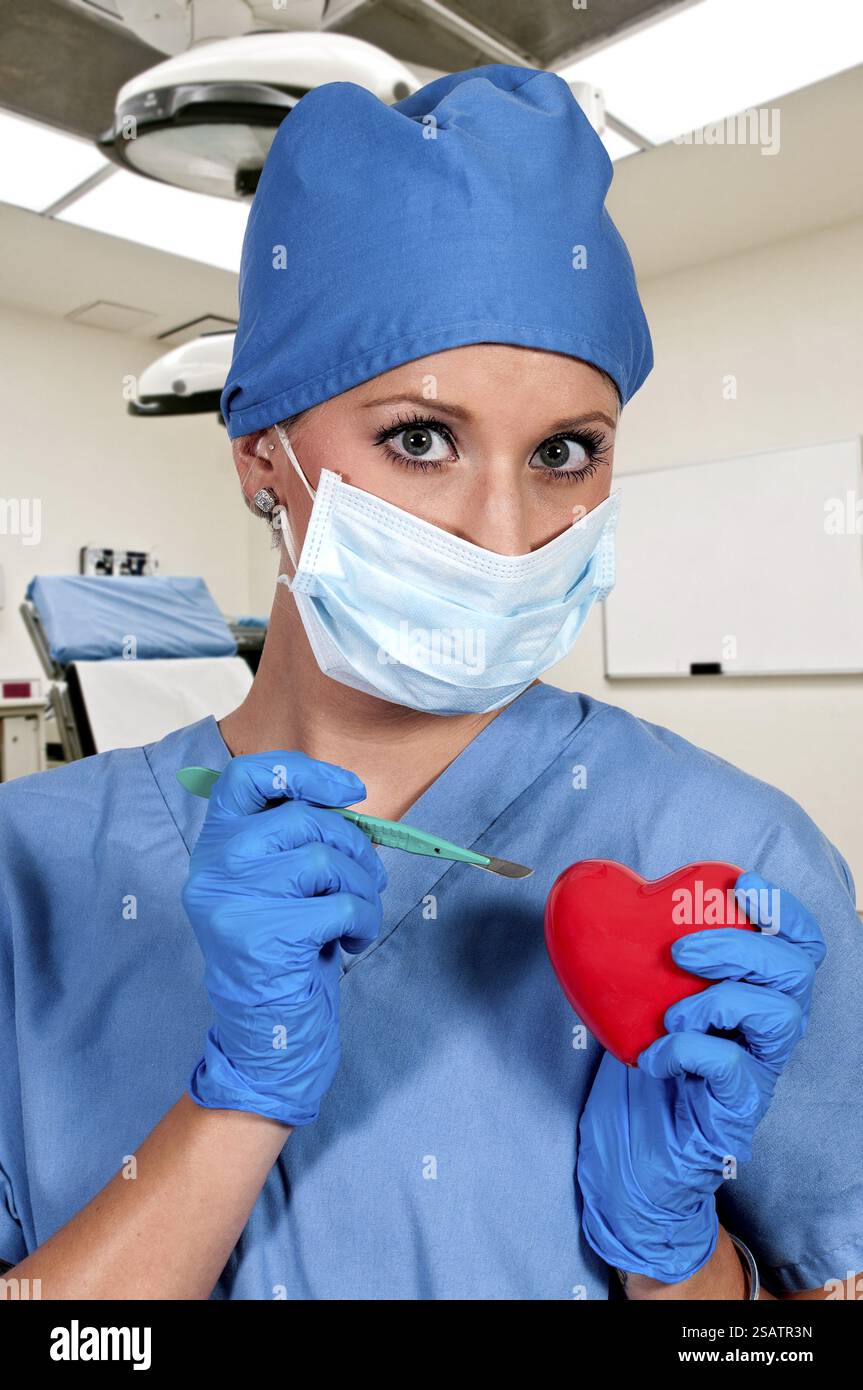 Beautiful young woman cardiology surgeon performing surgery Stock Photo ...