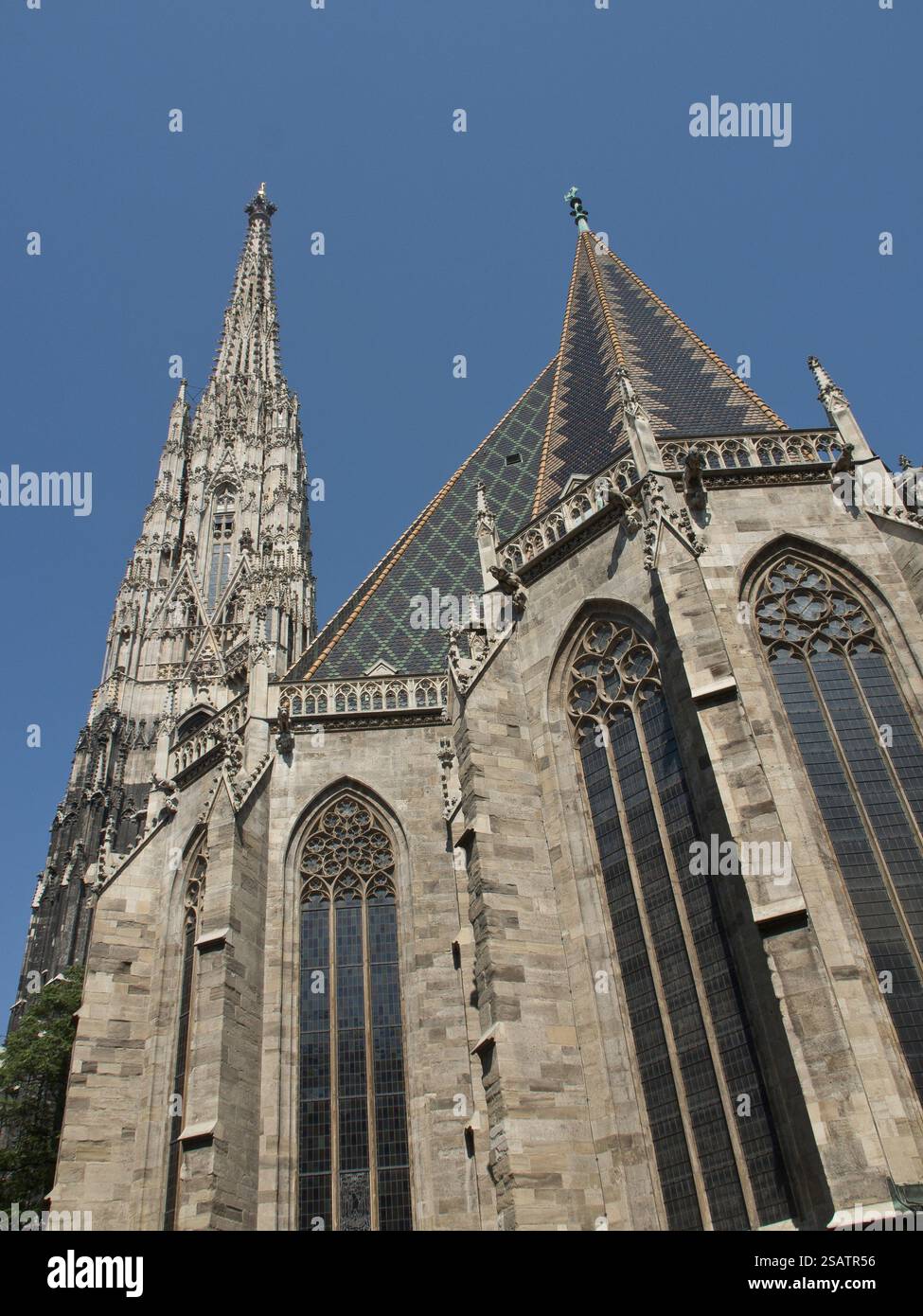 Massive Gothic church tower and detailed masonry, emphasised by the ...