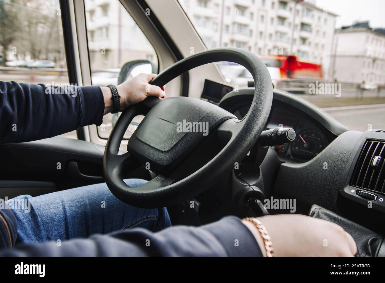 Driver's perspective from inside a vehicle cruising through city ...