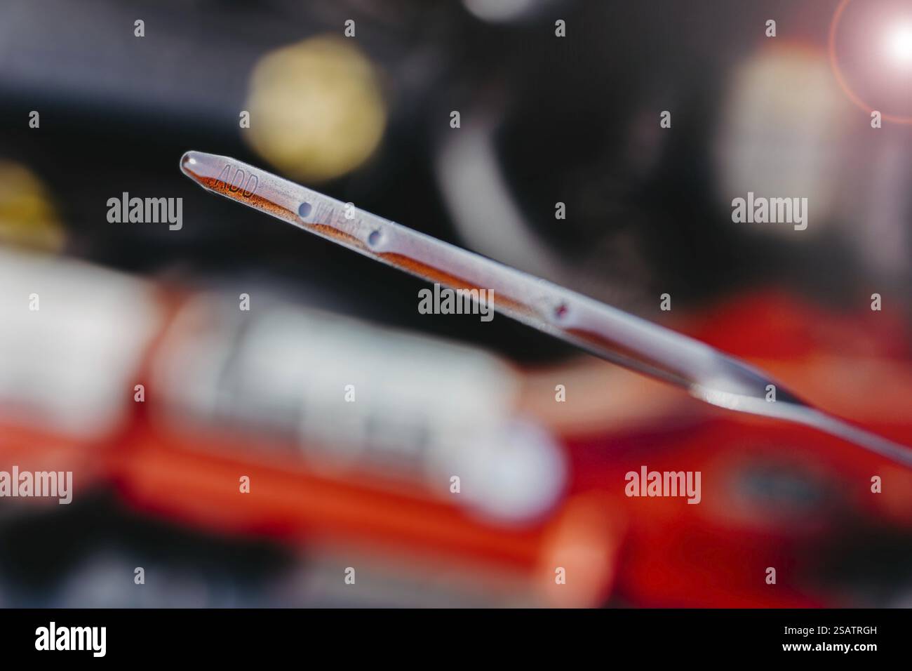 Dipstick with oil markings, used for checking automotive engine oil ...