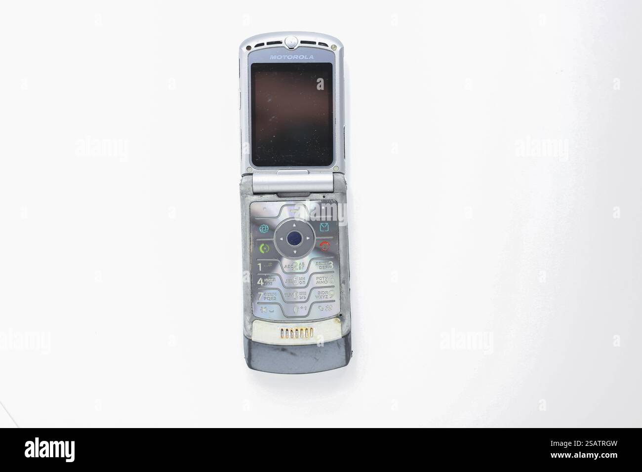 Classic Motorola flip phone open with display and keypad, symbolizing ...