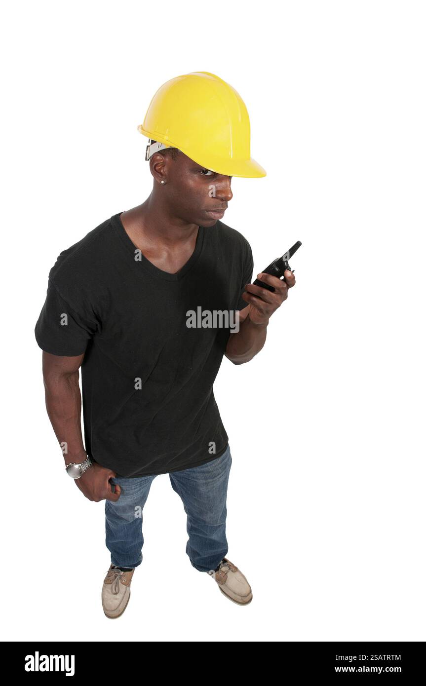 Handsome black man construction worker talking on a walkie talkie Stock ...