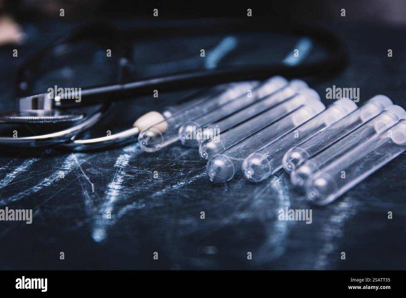 Stethoscope and scattered test tubes on dark chalkboard Stock Photo - Alamy