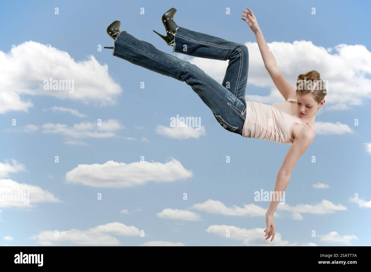 A beautiful young teenage woman falling through the sky Stock Photo - Alamy