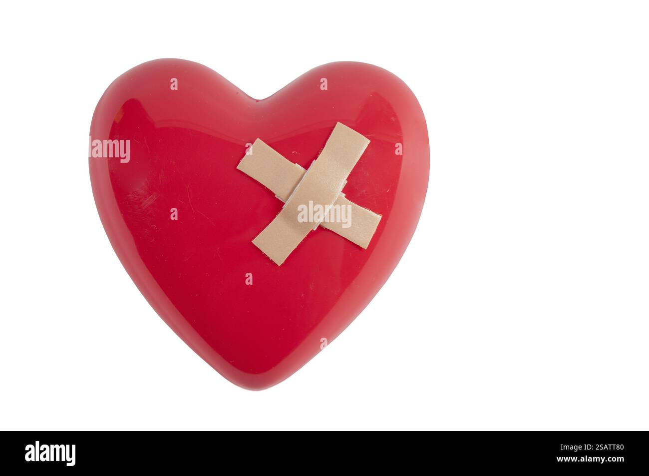 Broken heart mended by a couple of adhesive bandages Stock Photo - Alamy