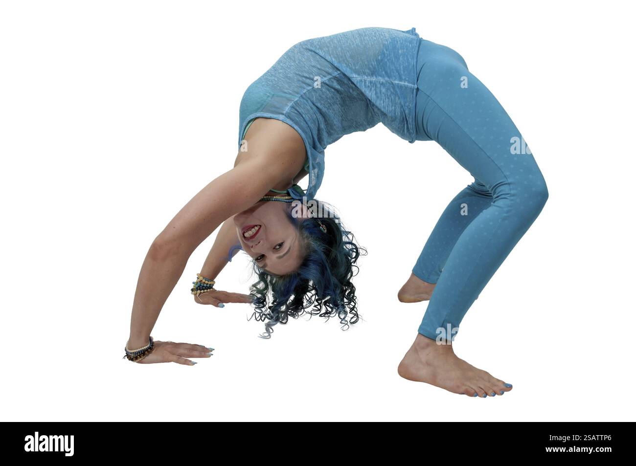 Beautiful woman practicing a back bend yoga position Stock Photo - Alamy