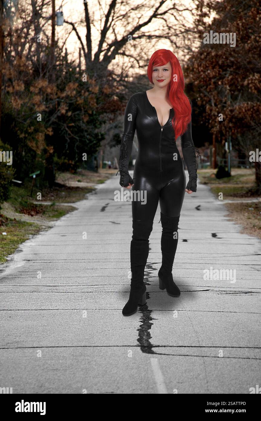 Beautiful woman wearing a black vinyl rubber latex cat suit Stock Photo ...
