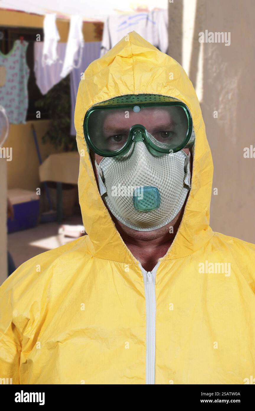 Man wearing a hazmat suit in the face of infectious disease Stock Photo ...