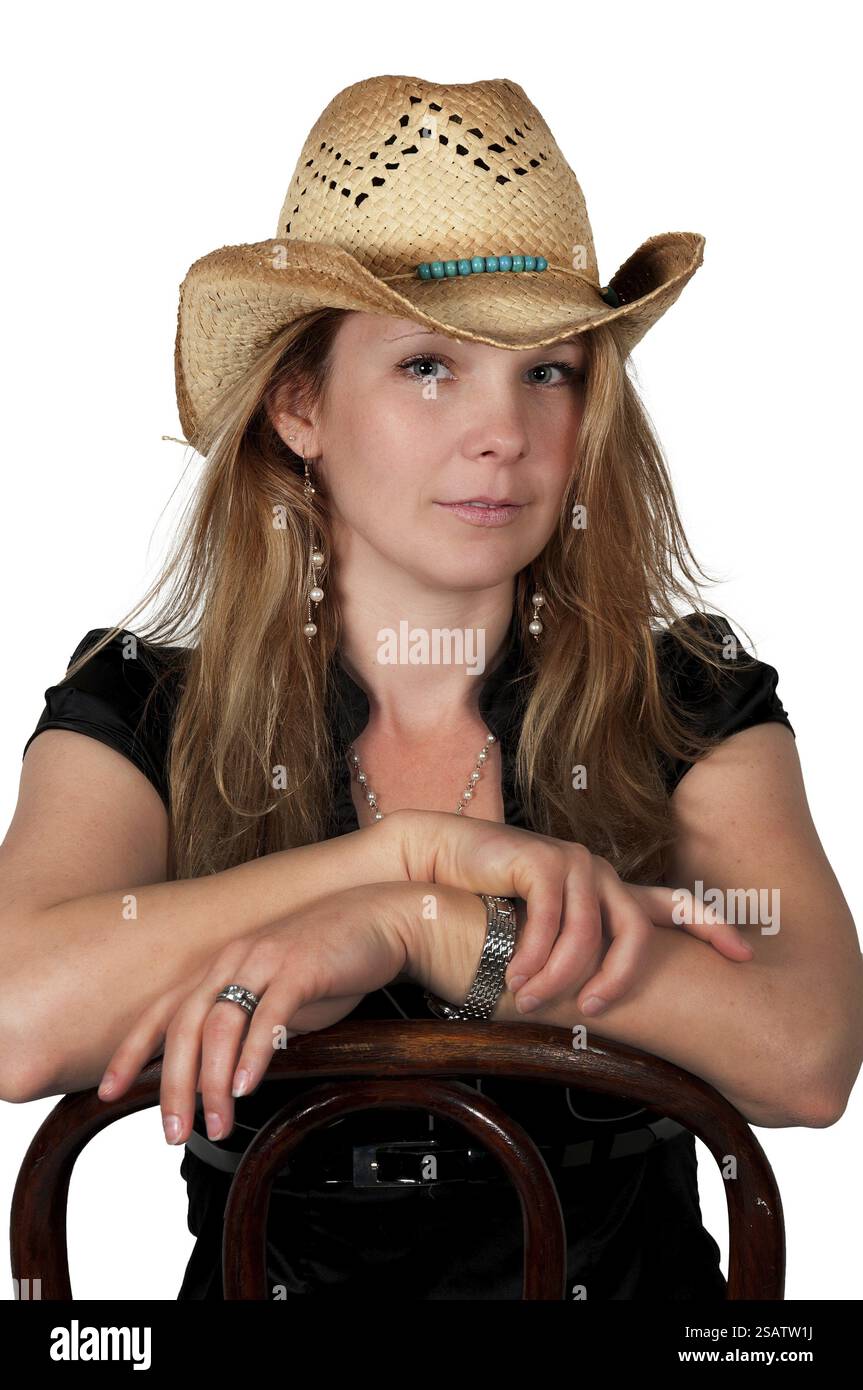 Beautiful young country girl woman wearing a stylish cowboy hat Stock Photo - Alamy