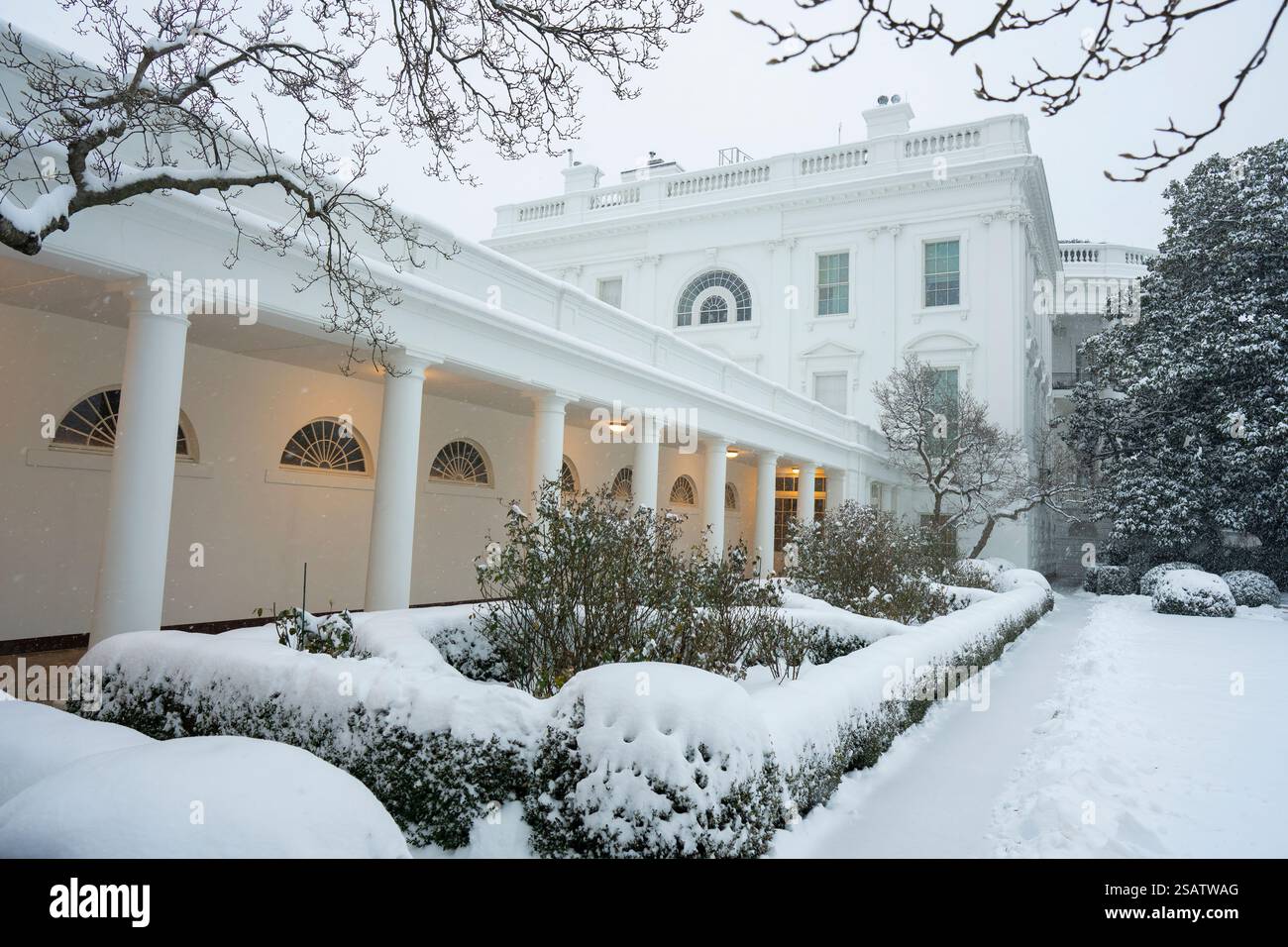 Snow falls on the White House, Monday, January 6, 2025, in Washington ...