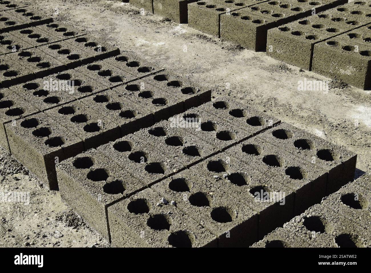 Freshly made cinder blocks on a concrete pad Stock Photo - Alamy