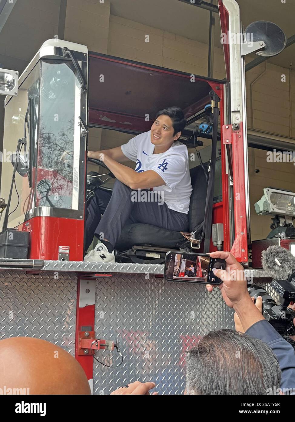 Los Angeles Dodgers star Shohei Ohtani sits in the cabin of a fire ...