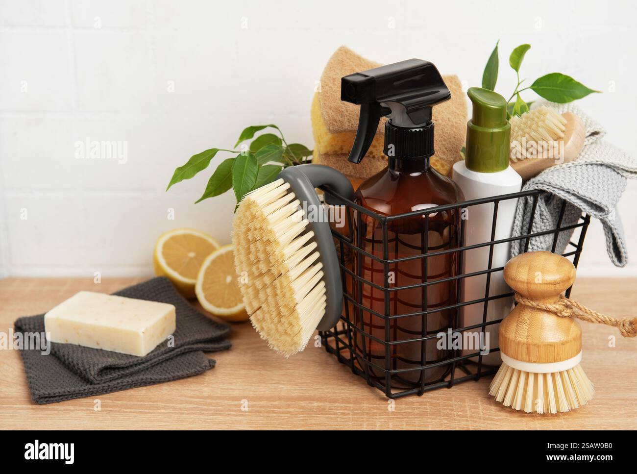 Basket with eco friendly cleaning products, dishwashing brushes ...