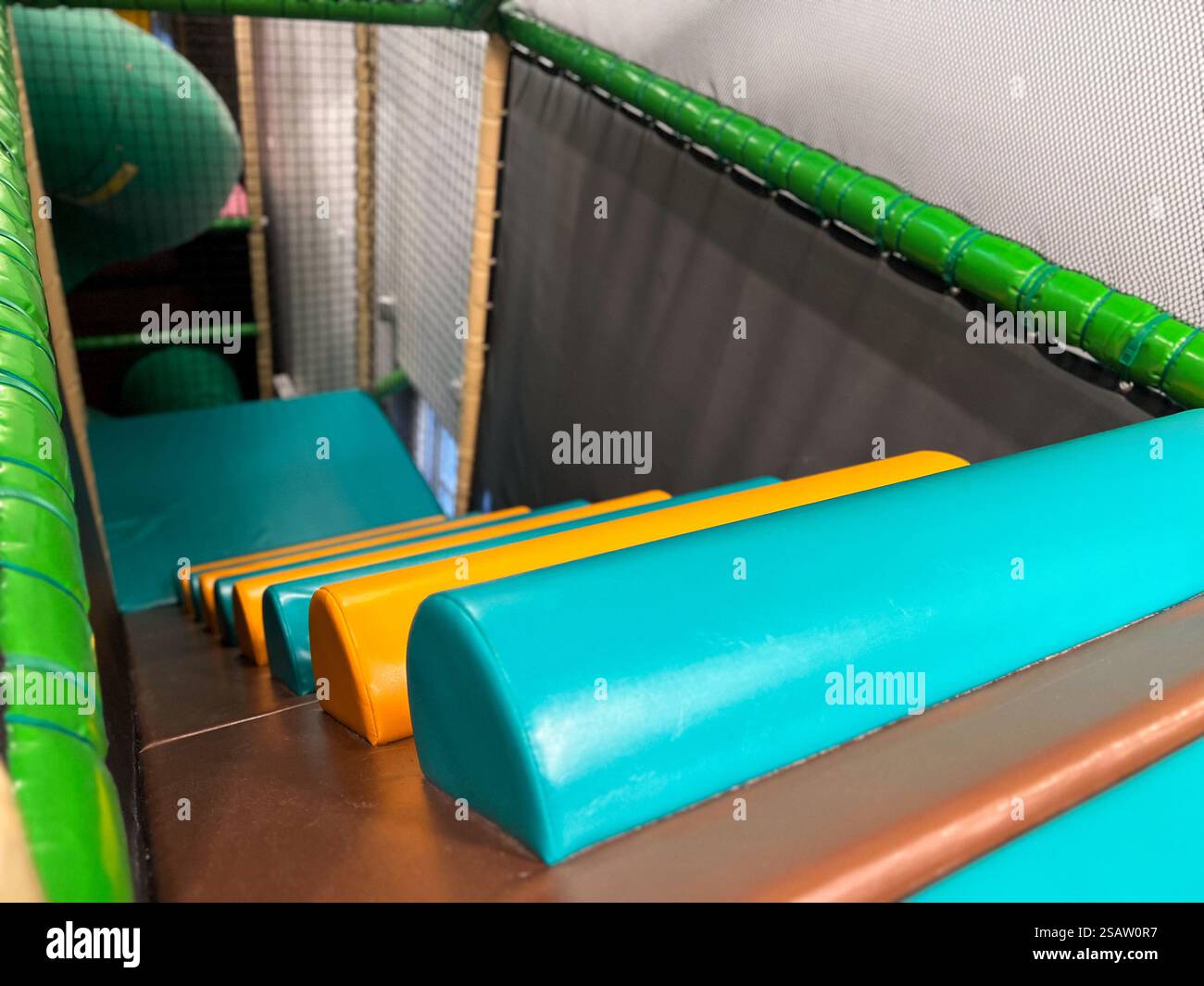 Colorful fun indoor playground area for children Stock Photo - Alamy