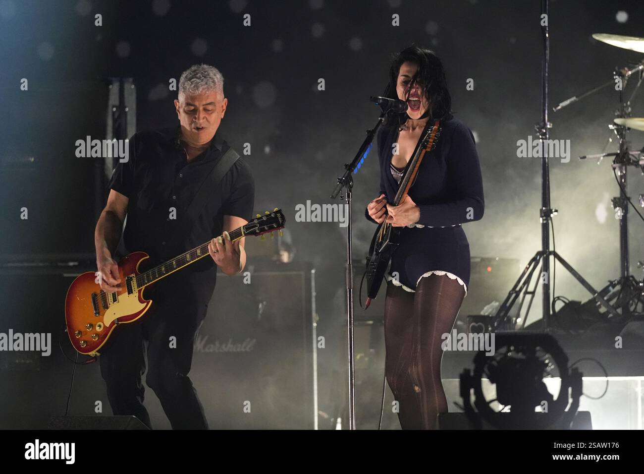 St. Vincent, right, performs with Pat Smear of Nirvana during the FireAid benefit concert on ...