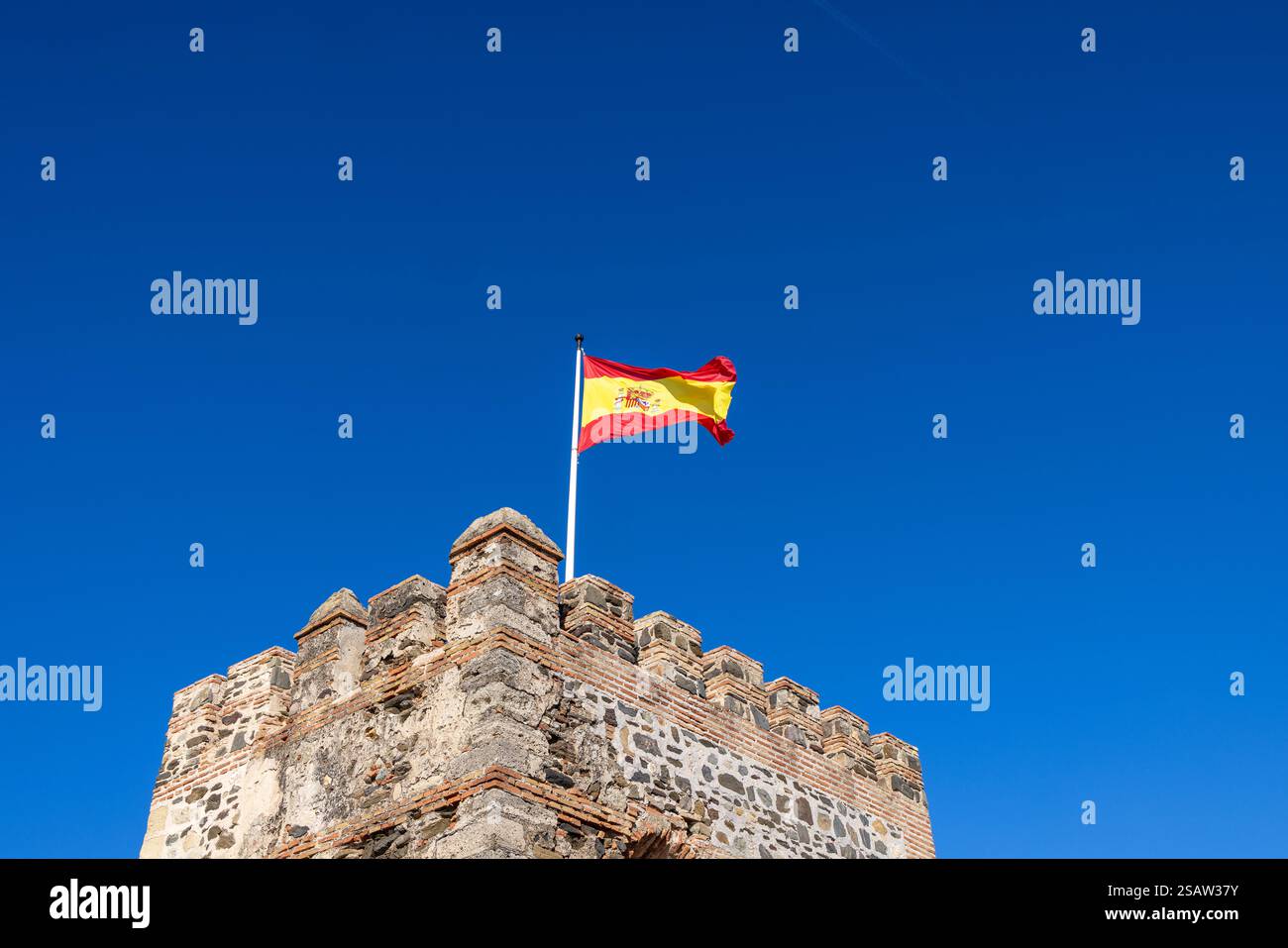 Photo of the Spanish flag showing the flag from Spain blowing in the wind on a clear sunny ...