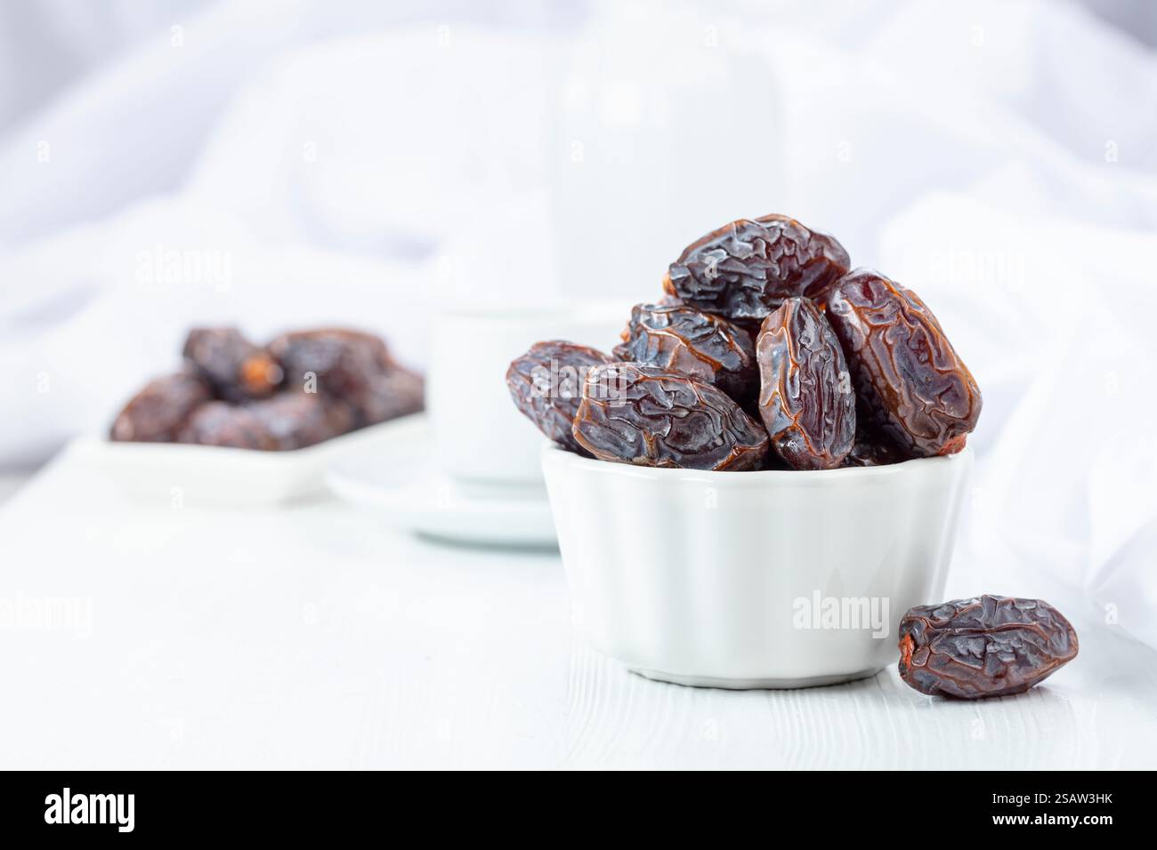 Dried medjool dates on a white kitchen table Stock Photo - Alamy