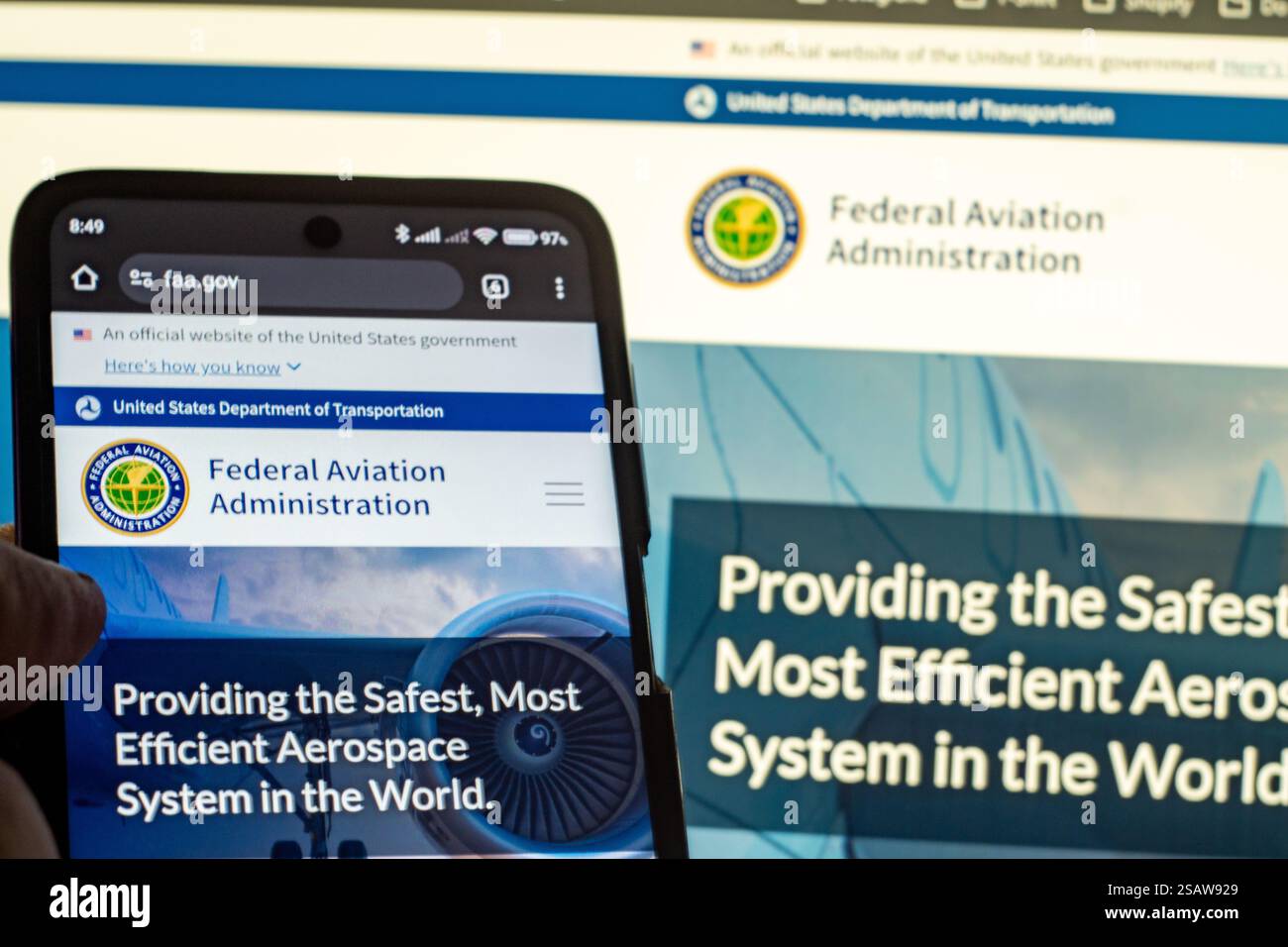 A mobile device displays the official website of the Federal Aviation ...