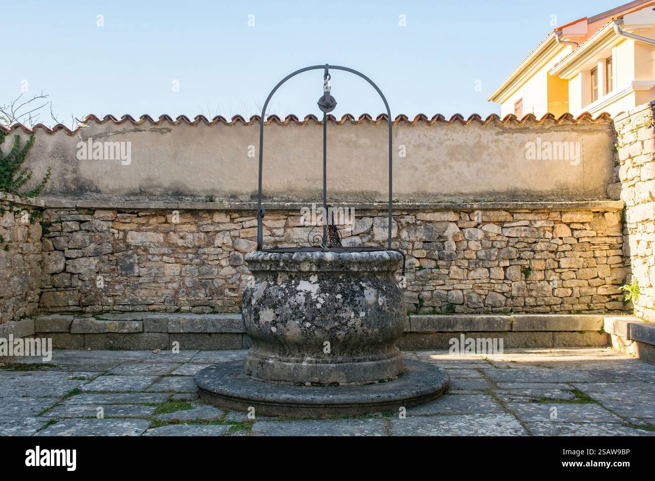 A traditional stone well in the historic village of Svetvincenat in ...