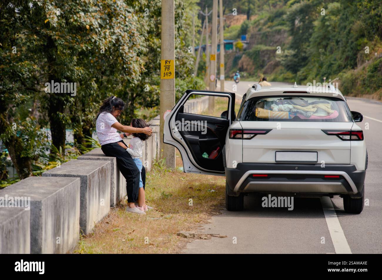A heartwarming image of a mother and daughter sitting together on a ...