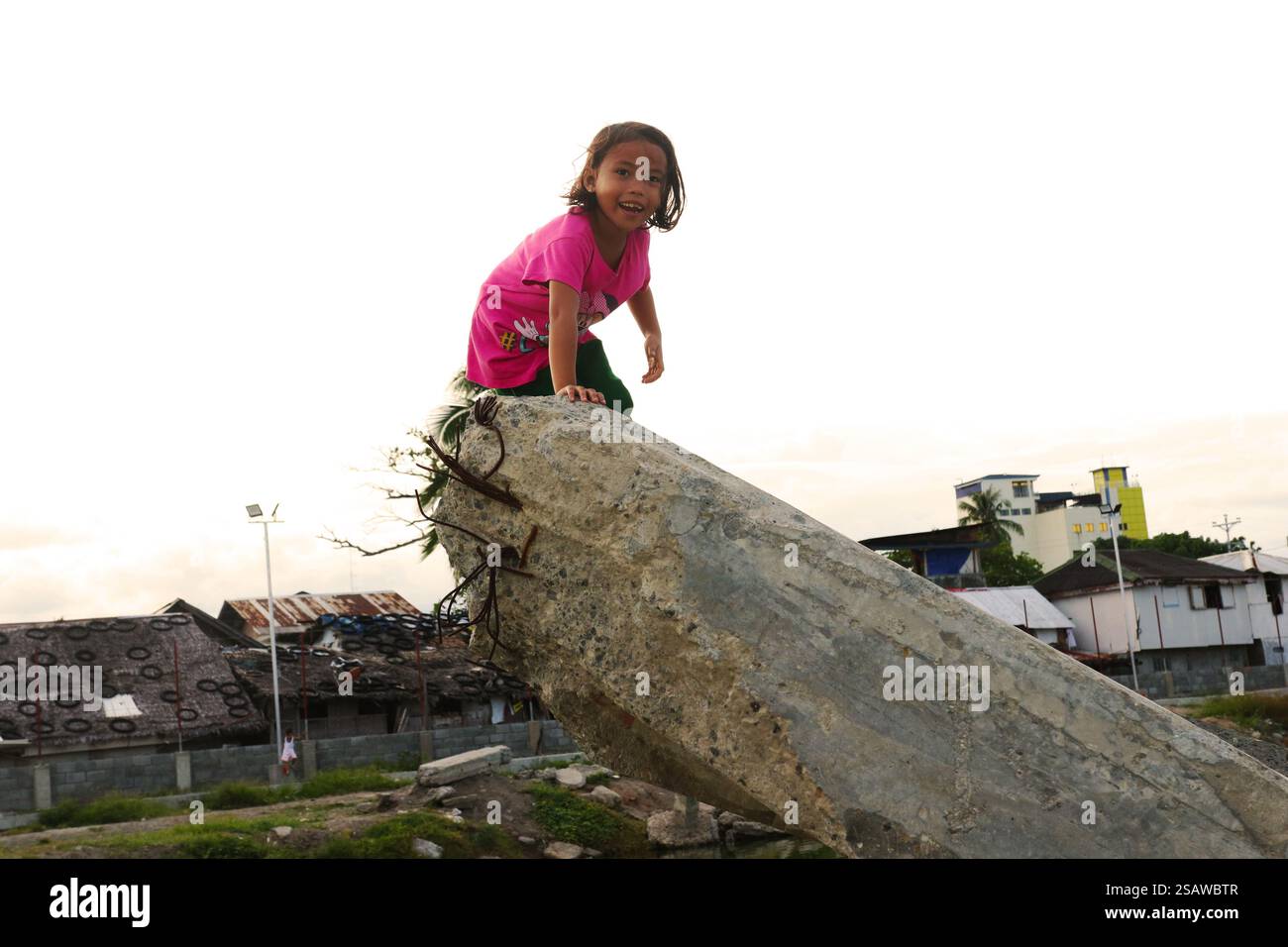 Dumaguete City, Negros Oriental, Philippines - January 30, 2025: A kid ...