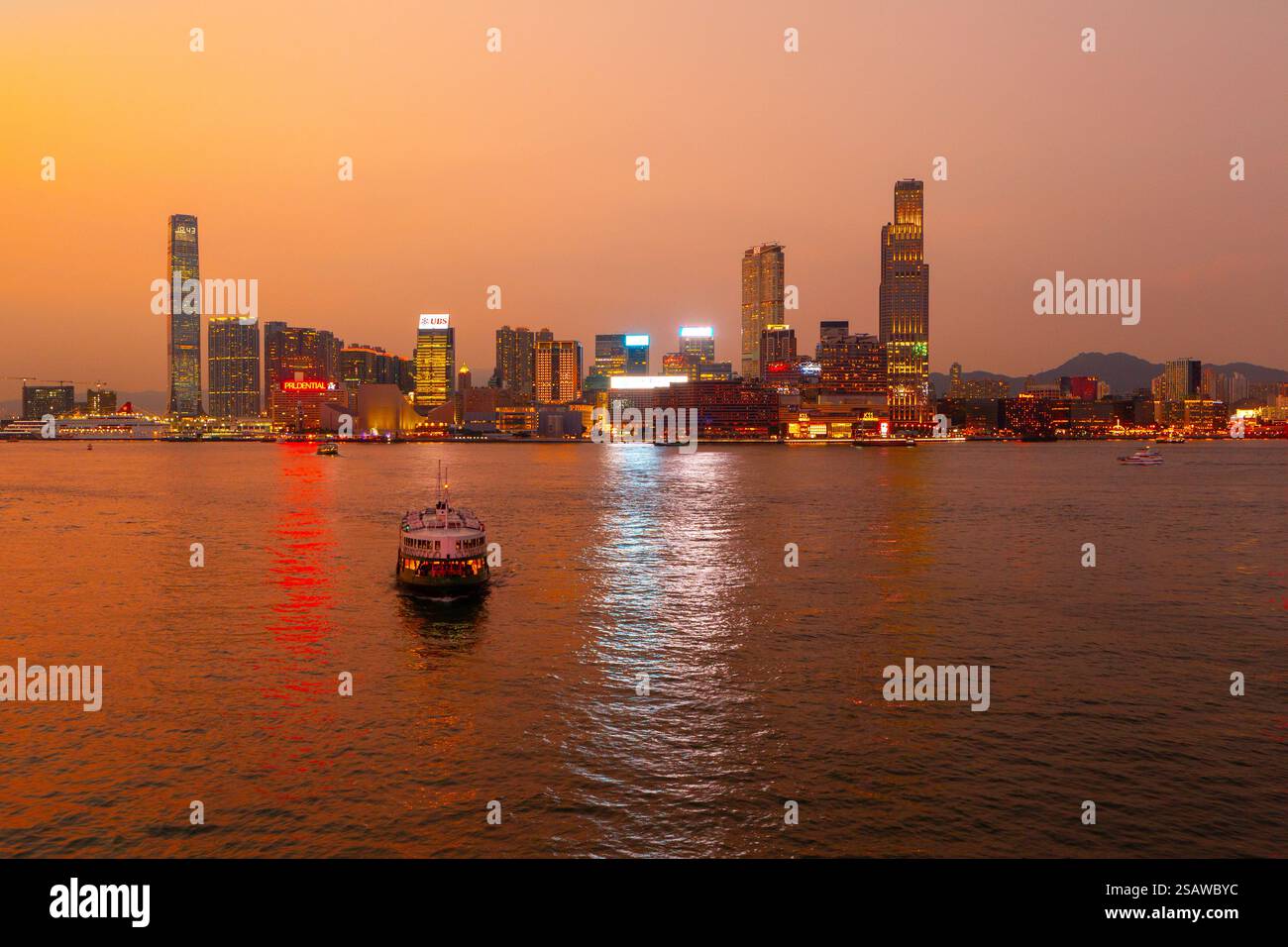 Sunset on Victoria Harbour and the skyline of Kowloon Island in Hong ...