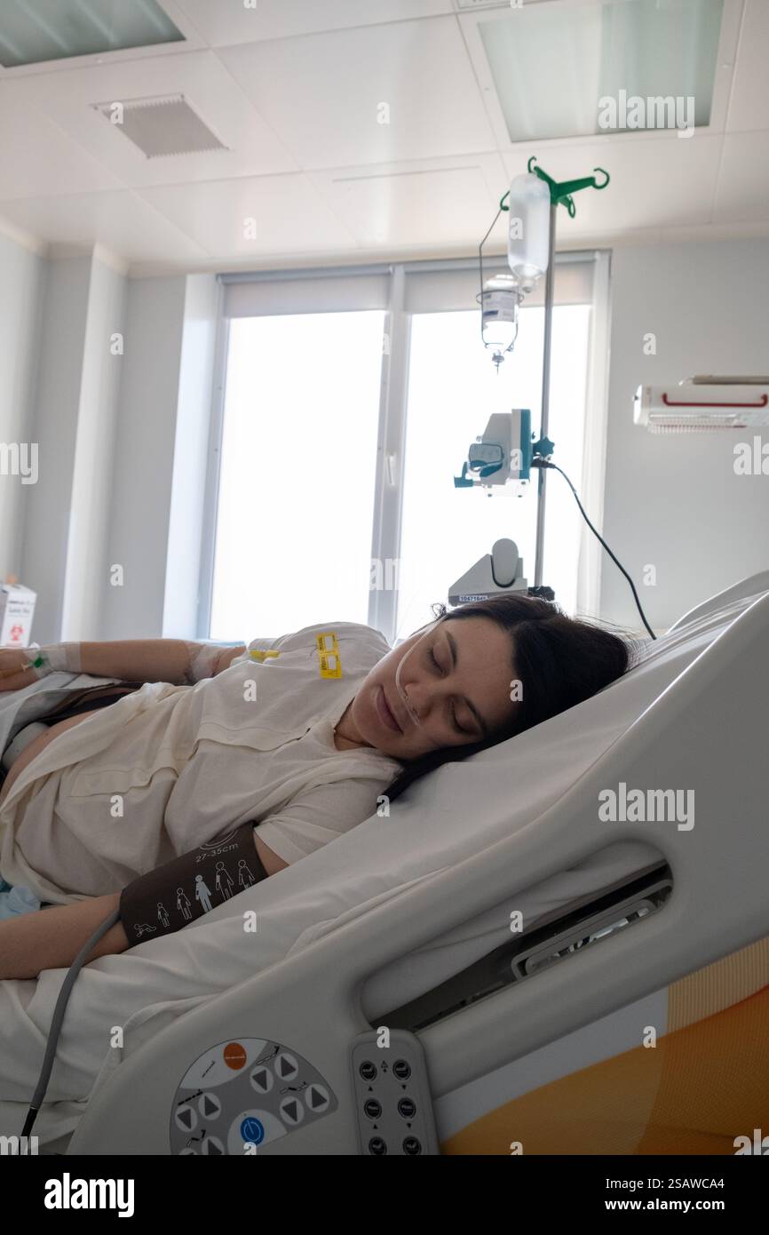 Patient Resting in Hospital Bed with Medical Equipment Stock Photo - Alamy
