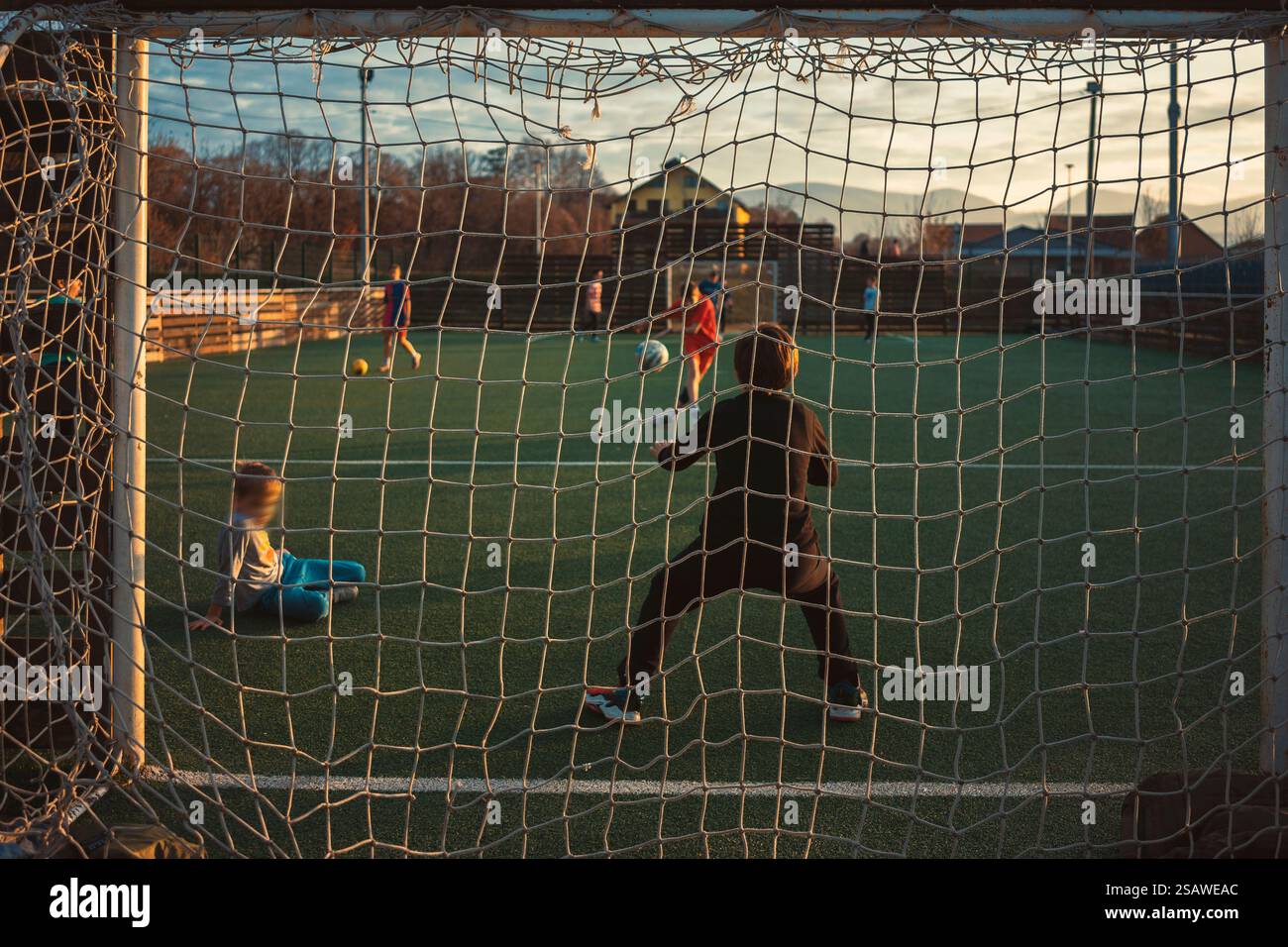 Football training for children, the goalkeeper got ready to defend him ...