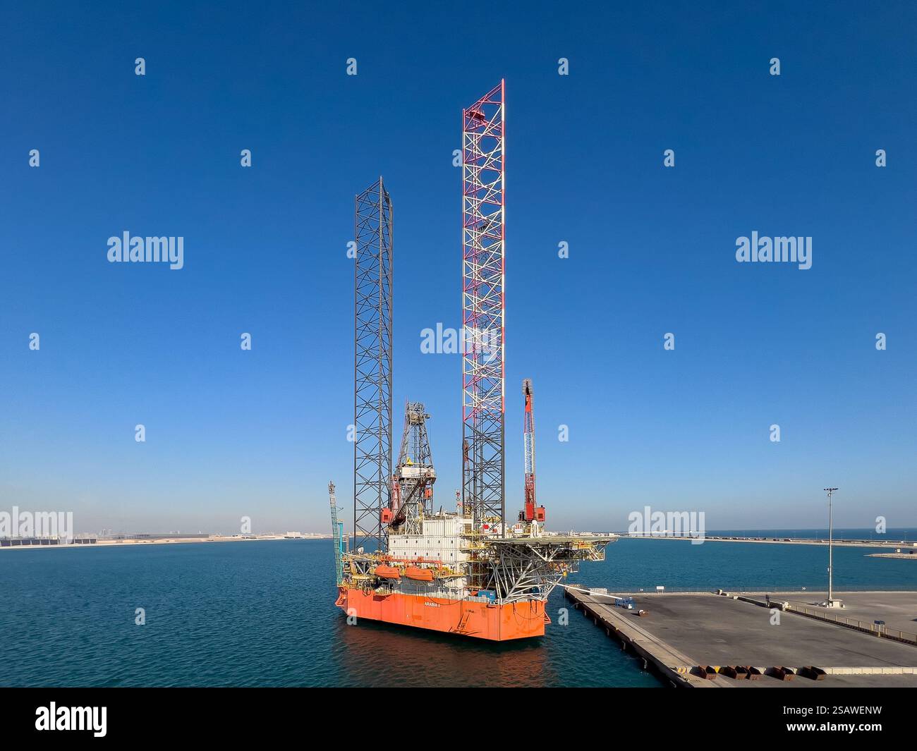 Manama, Bahrain - January 5, 2025: An offshore oil rig stands tall in ...