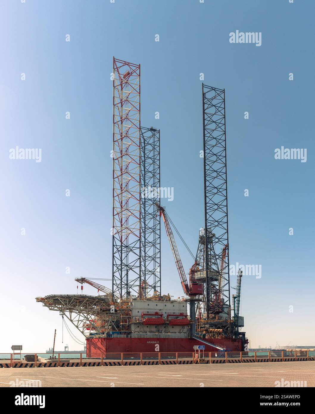 Manama, Bahrain - January 5, 2025: A towering offshore oil rig stands ...