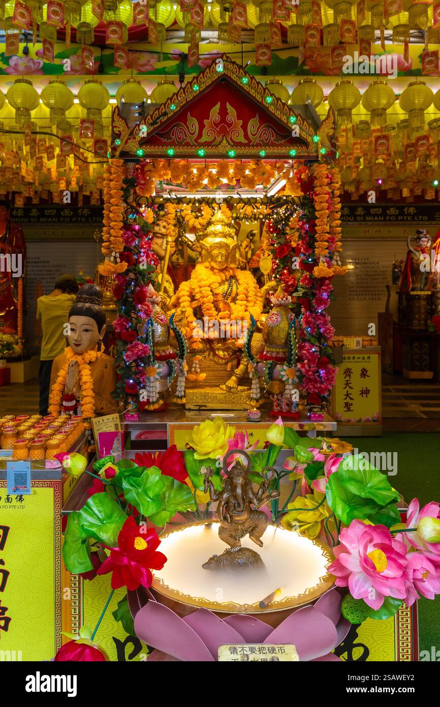 The four faced Buddha in downtown Singapore has four faces but he isn't ...