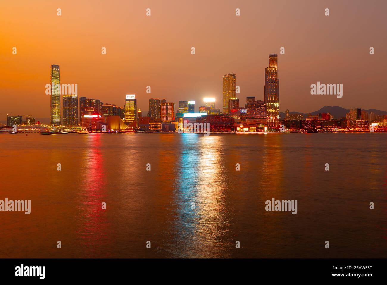 Sunset on Victoria Harbour and the skyline of Kowloon Island in Hong ...