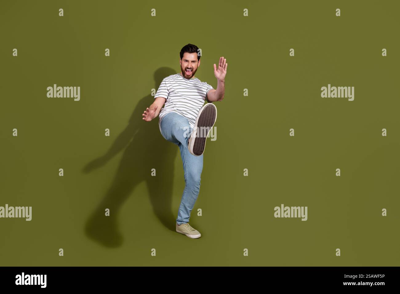 Photo of strong crazy man wear striped stylish clothes fighting ...