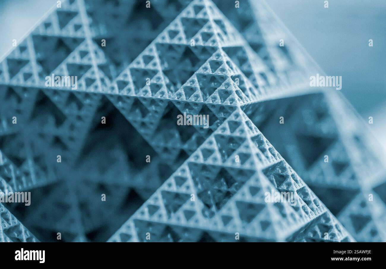 Small model of pyramid printed on 3D printer close-up. Object created ...