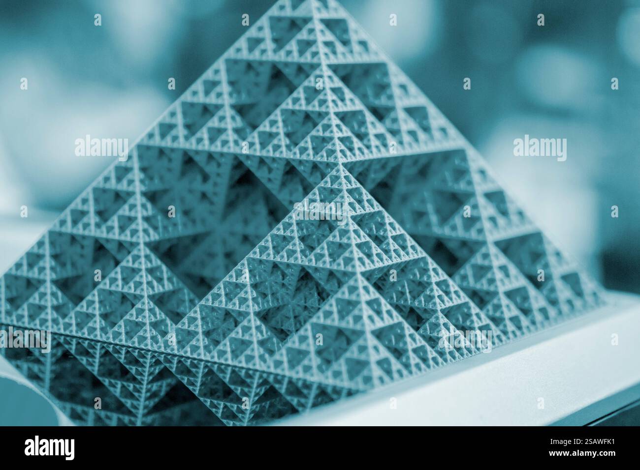 Small model of pyramid printed on 3D printer close-up. Object created ...