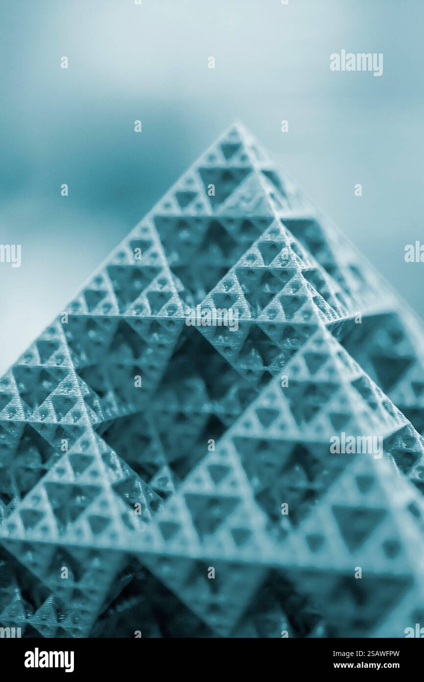 Small model of pyramid printed on 3D printer close-up. Object created ...