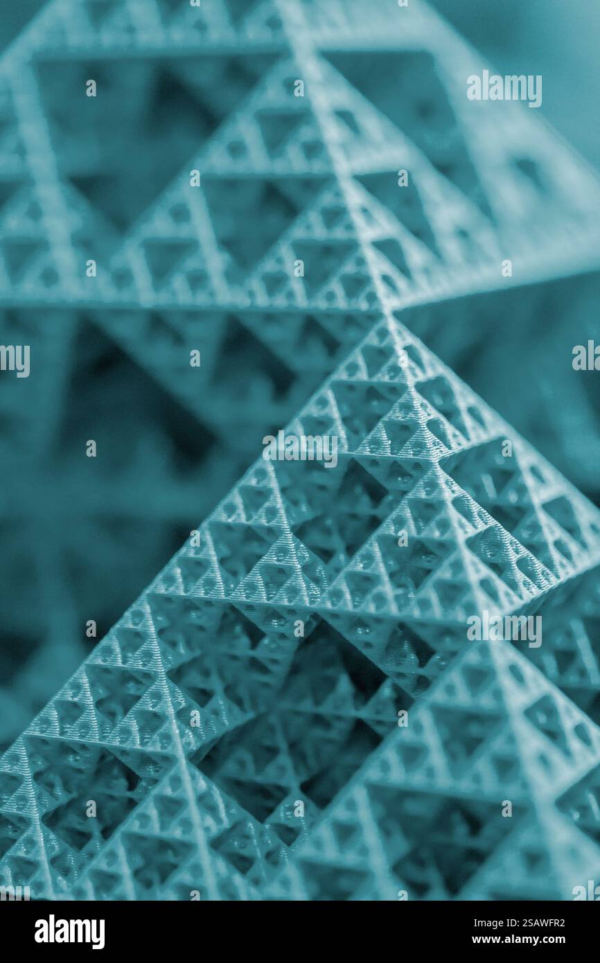 Small model of pyramid printed on 3D printer close-up. Object created ...