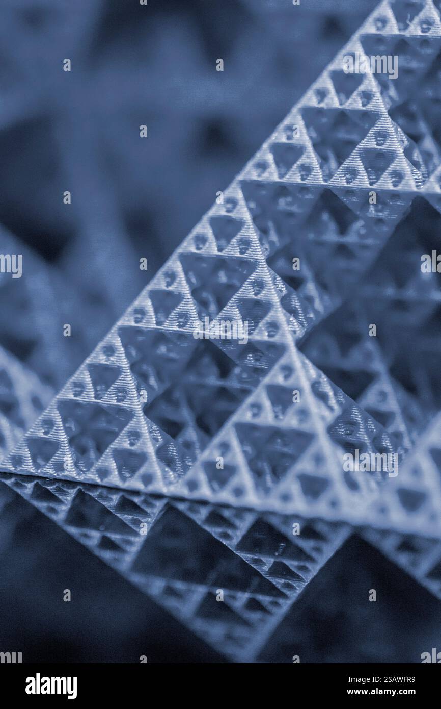 Small model of pyramid printed on 3D printer close-up. Object created ...