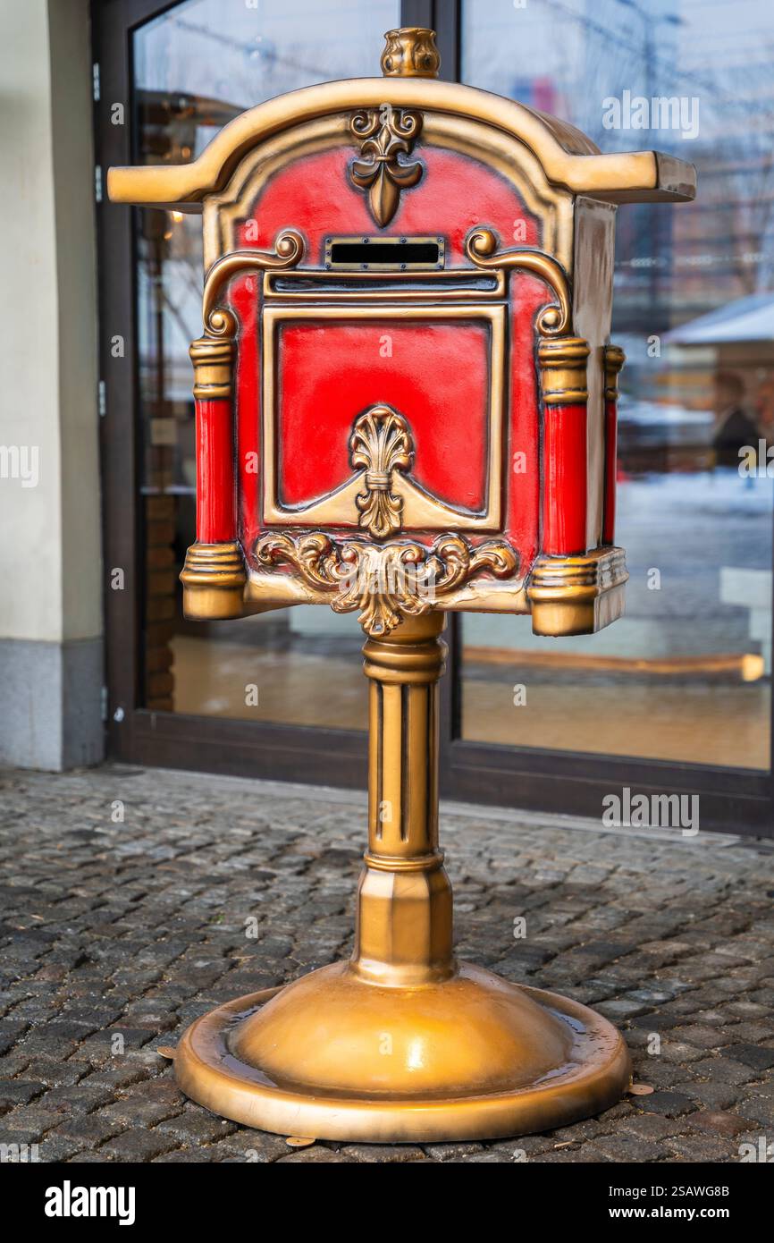 Closeup of Red and gold post box for letters to Lapland to Santa Claus ...