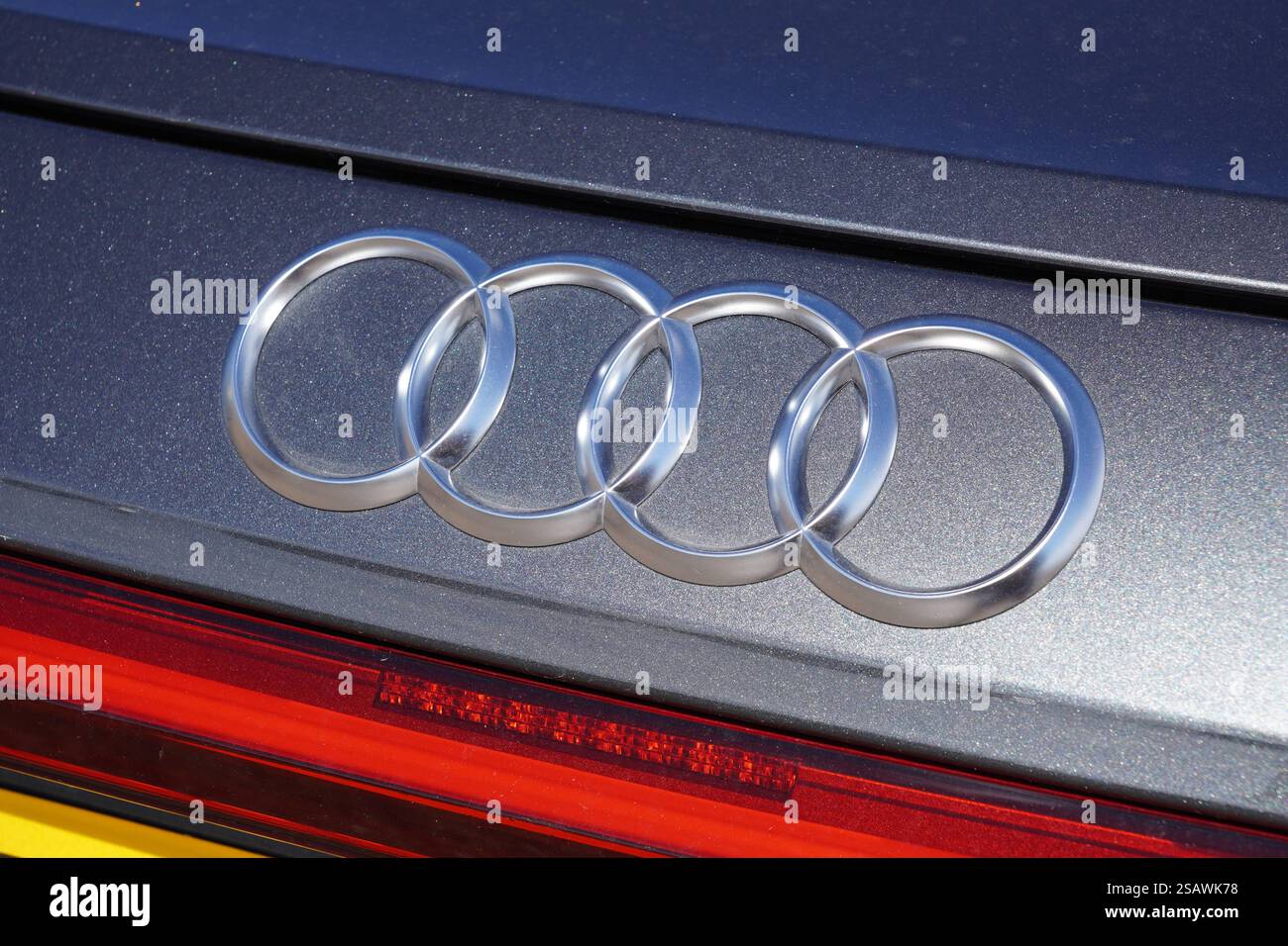 Audi car brand logo on silver motor vehicle. German car manufacturer ...