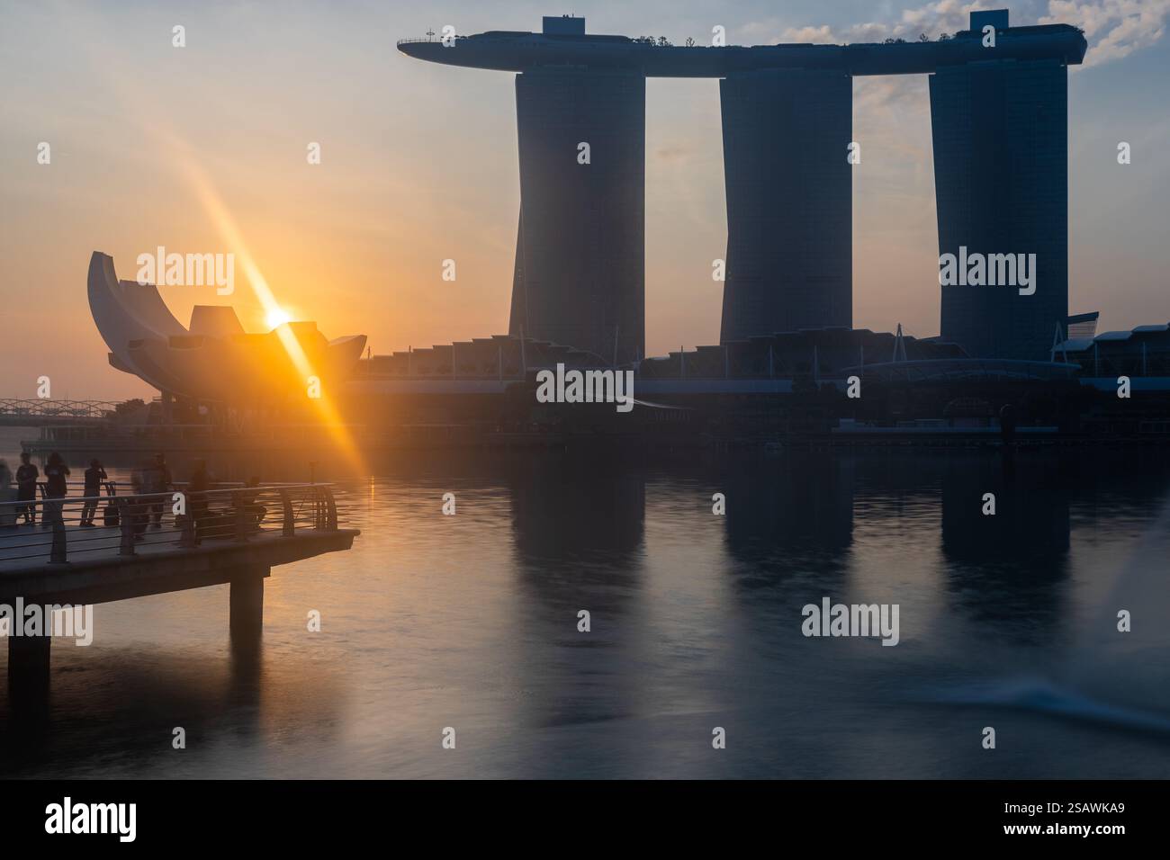 sunrise at the promenade with Marina Bay Sands hotel, the iconic ...