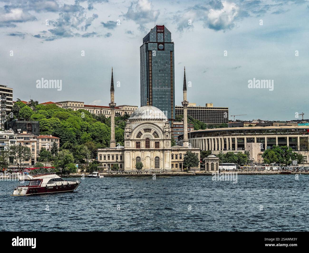 A grand mosque with intricate details situated by a waterfront ...