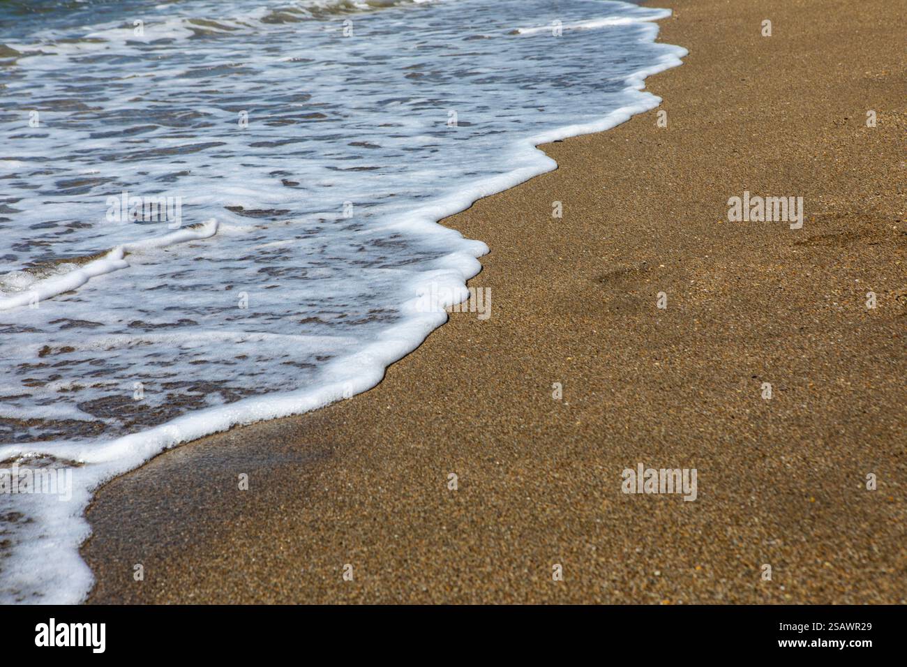 The water on the shoreline of Playa de Bil-Bil, or Bil-Bil beach in ...