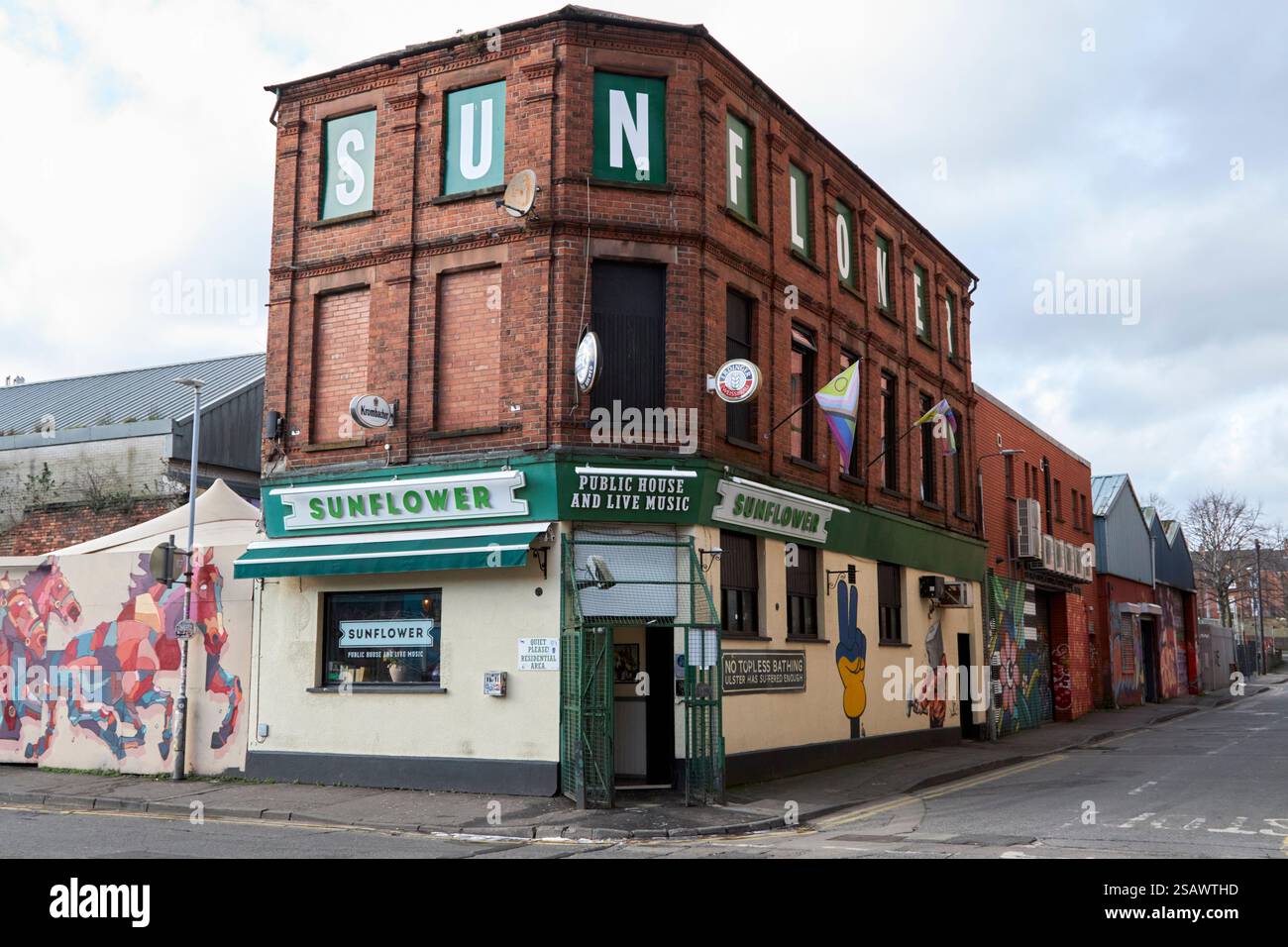 the sunflower public house corner pub with old security gate still ...