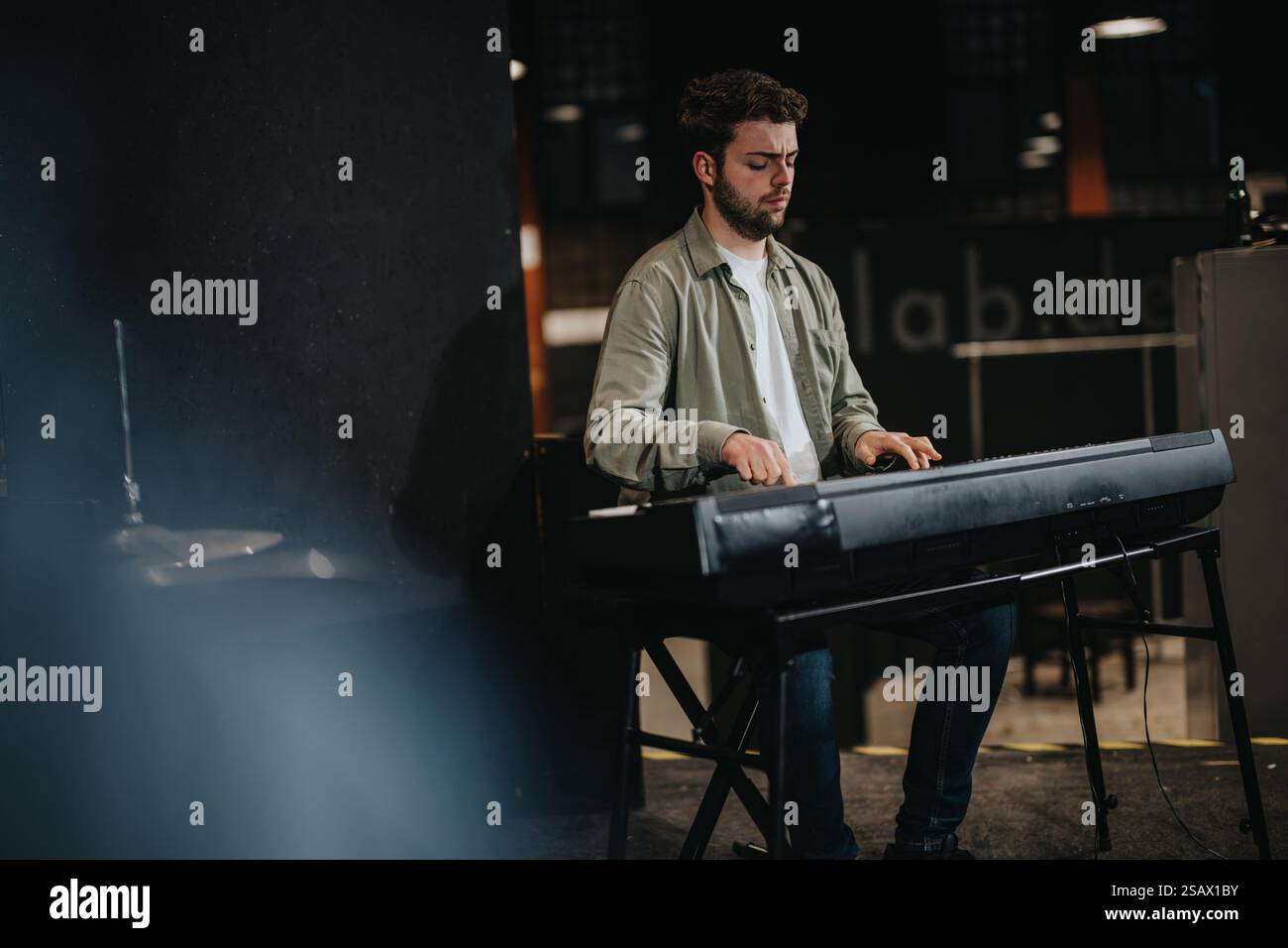 Man Playing Electric Keyboard on Stage During a Performance Stock Photo ...
