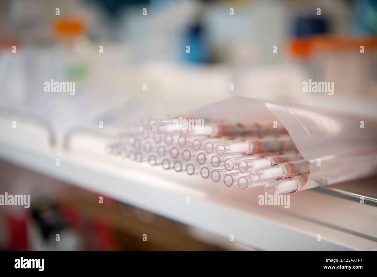 extended length pipette tips laying on biotech science lab shelf Stock ...