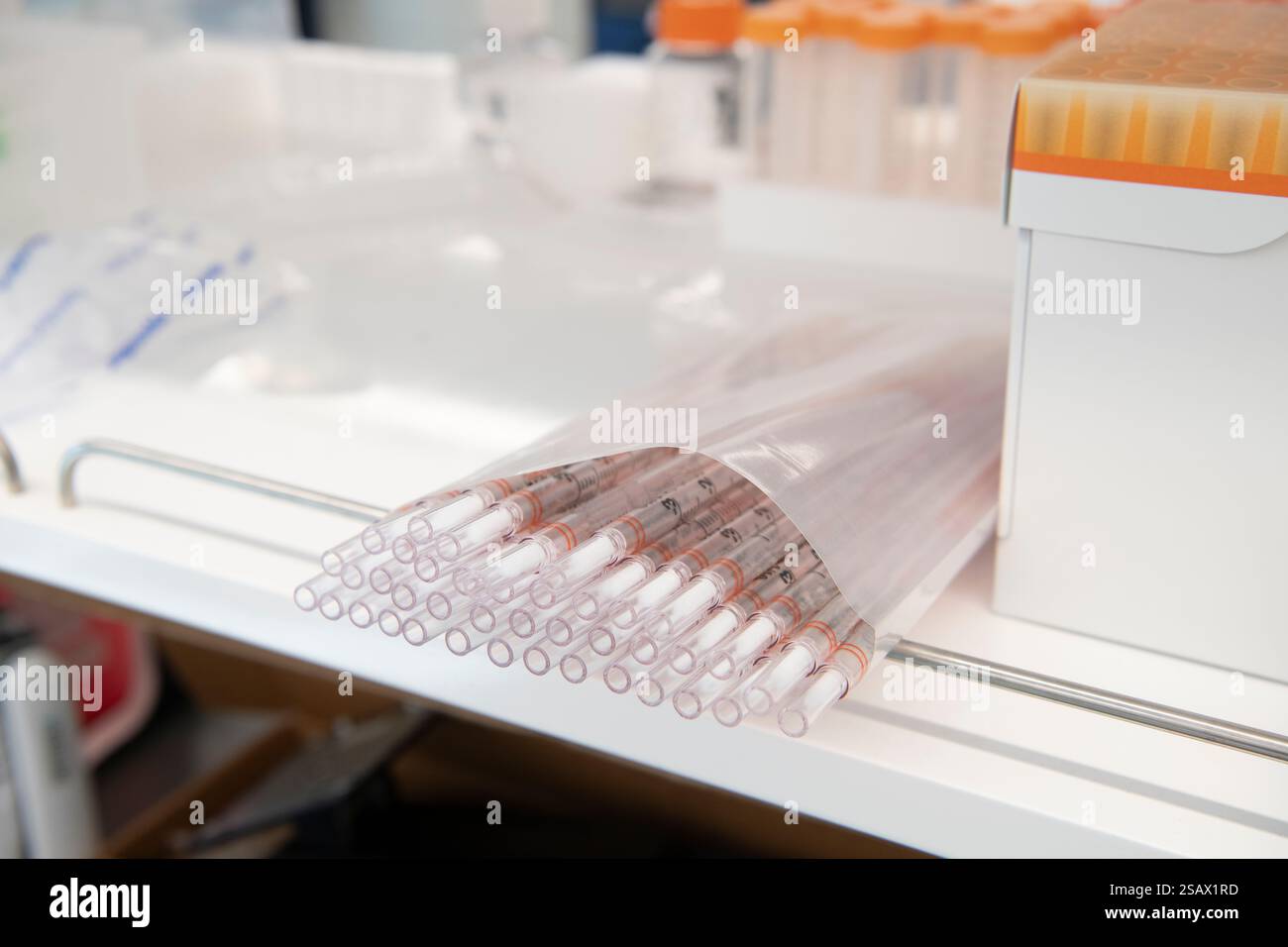 extended length pipette tips laying on biotech science lab shelf Stock ...