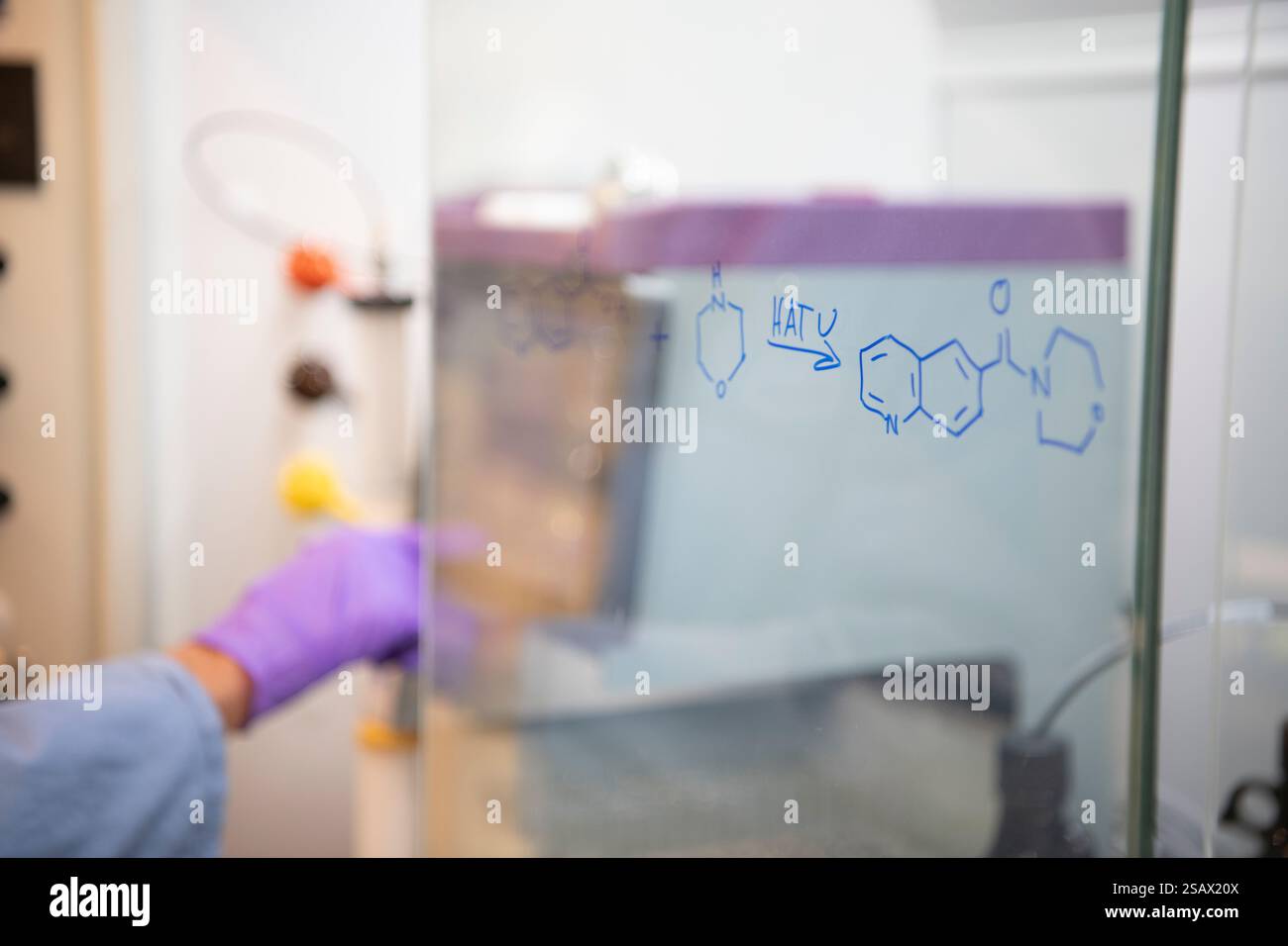Formula written on glass of biotech hood in science medical lab Stock ...