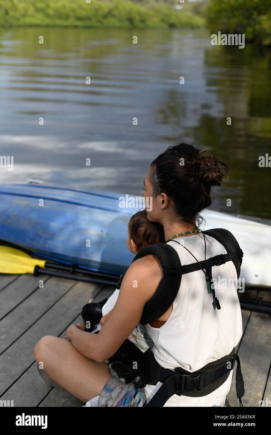 Child on parent's lap nature hi-res stock photography and images - Alamy