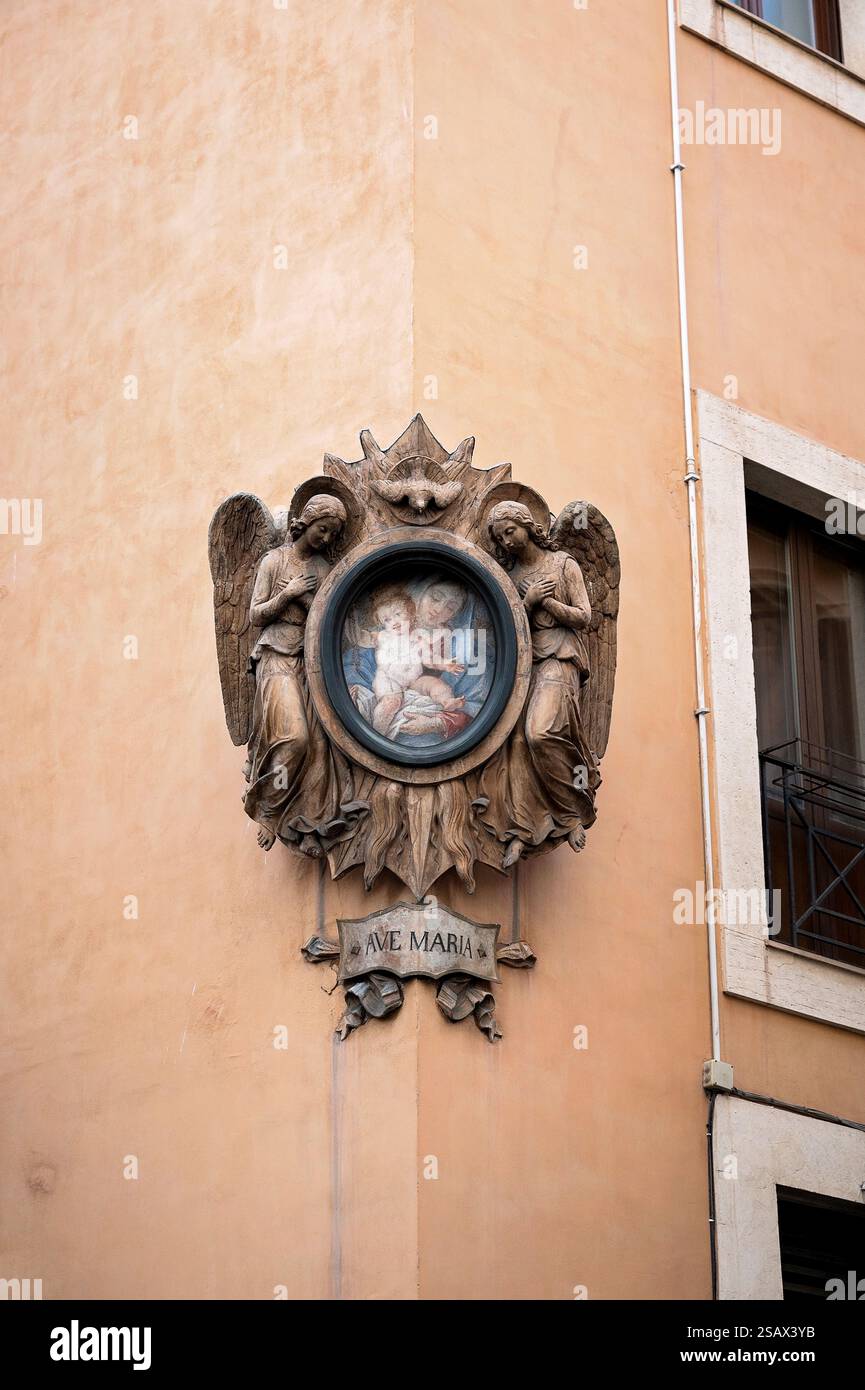 Ornate Ave Maria shrine with angels and Virgin Mary painting Stock ...